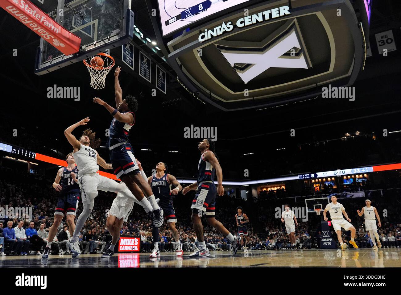 UConn forward Tarris Reed Jr., third from left, drives the basket over ...