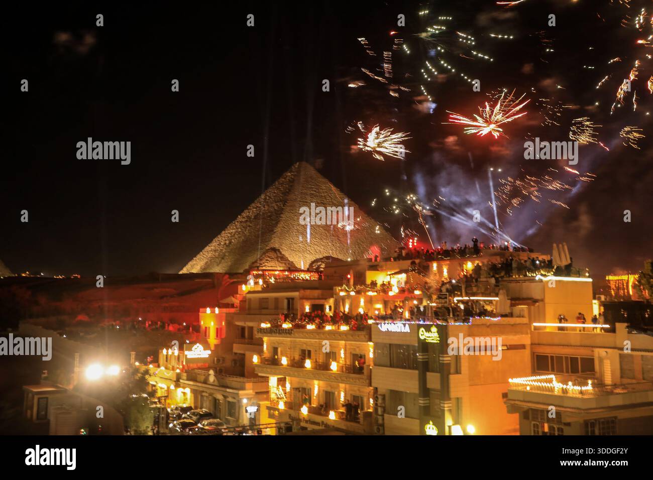 Fireworks light up the sky above the Great Pyramids of Giza during New ...