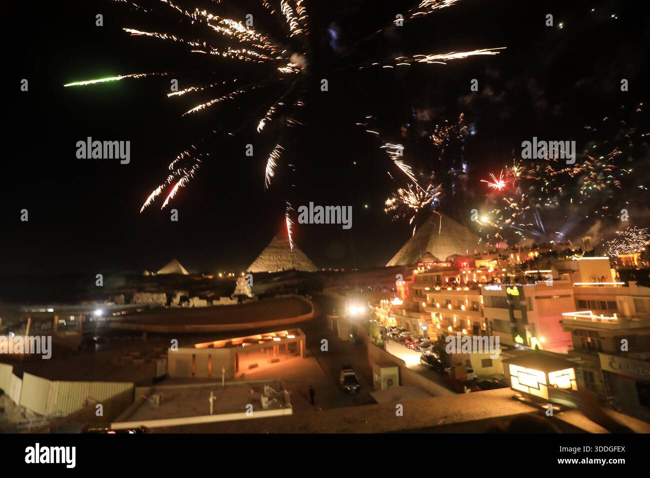 Fireworks light up the sky above the Great Pyramids of Giza during New ...