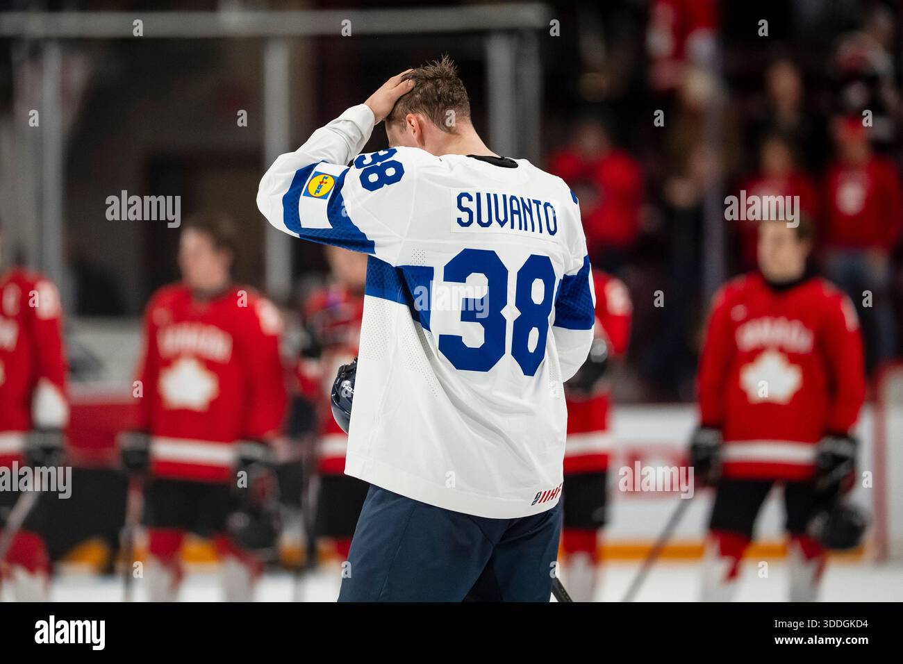 Finland's Oliver Suvanto (38) reacts after Finland was defeated by ...