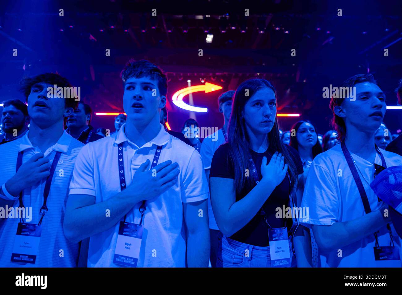 FILE - Attendees stand during Turning Point USA's AmericaFest 2025, Dec ...