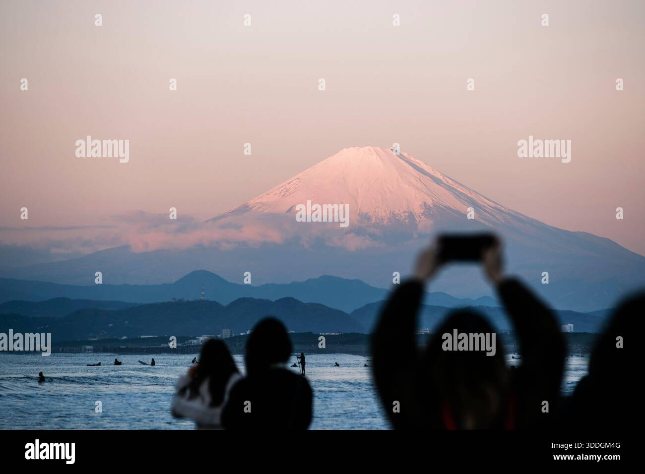 JANUARY 1, 2026 People photograph Mount Fuji during Hatsuhinode, a ...