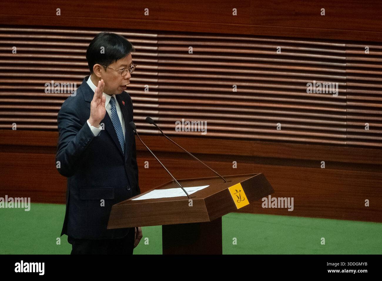 An incoming lawmaker Chan Chun-ying takes an oath in the chamber of the ...