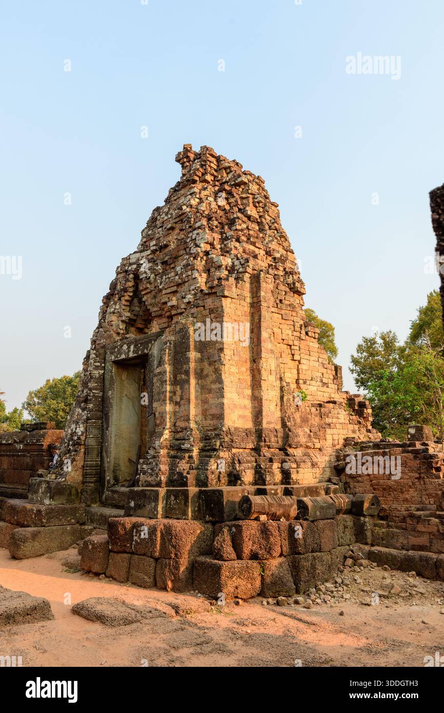 Sunlit view of an ancient red brick sanctuary tower at Pre Rup temple ...