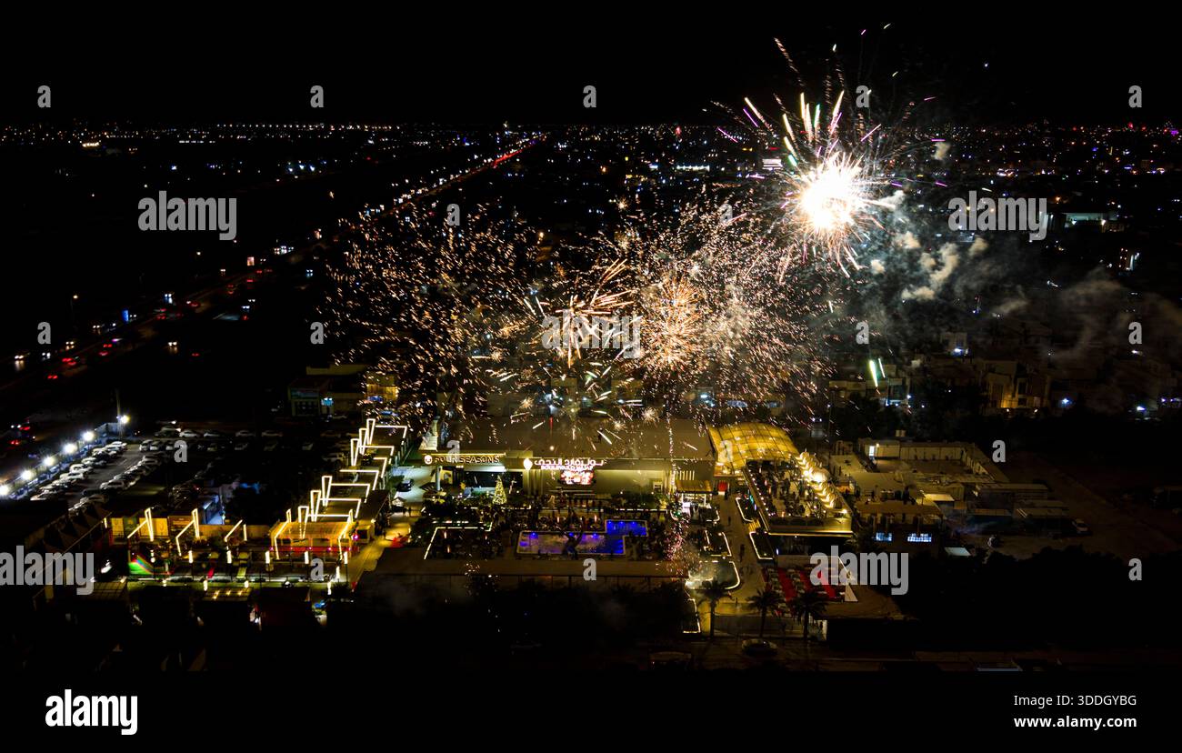 In this image shot with a slow shutter speed, fireworks light up the ...