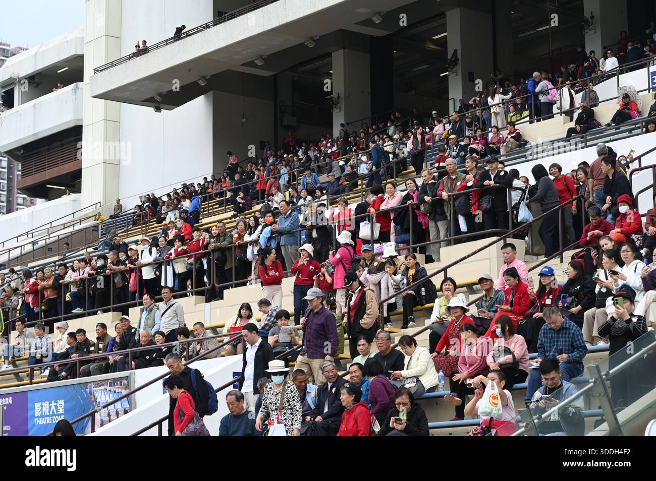 A general view showing the people watching horse racing at Sha Tin ...