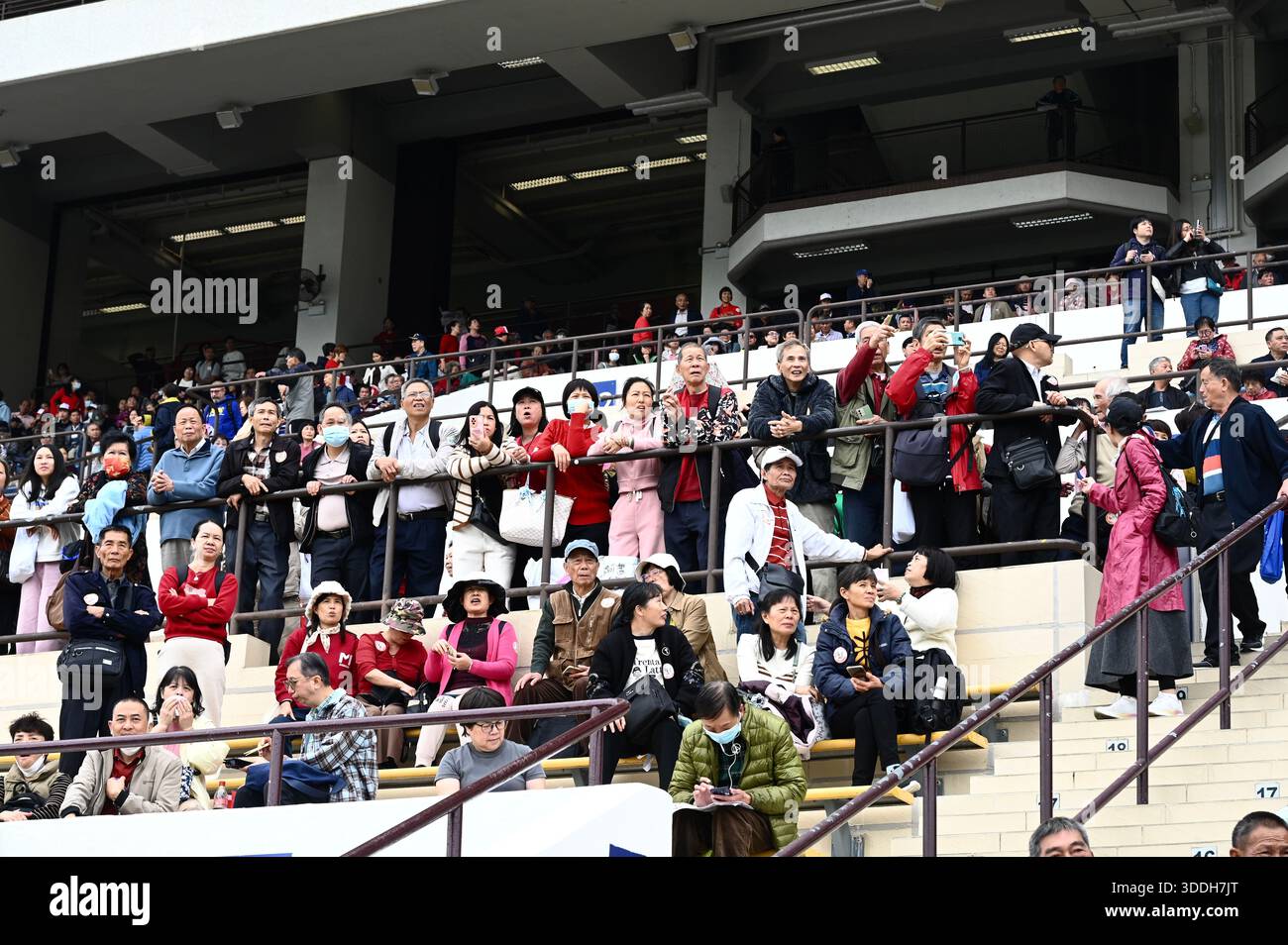 A general view showing the people watching horse racing at Sha Tin ...