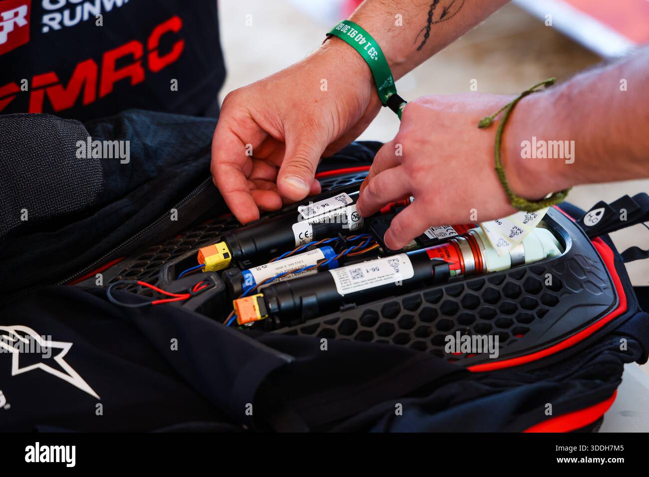 ASO Staff steward scrutineers bike airbag during the Administrative and Technical Scrutineering ...