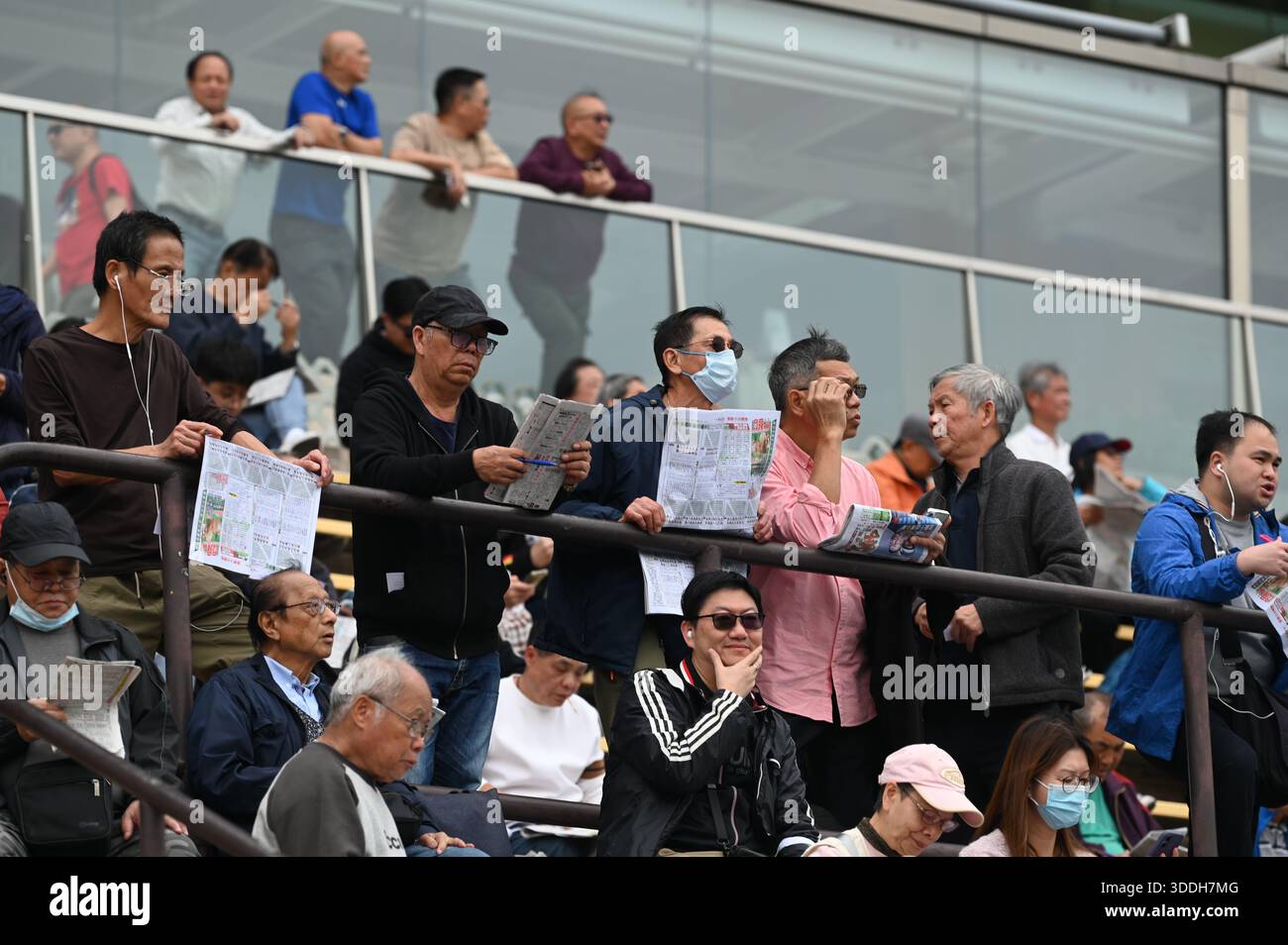 A general view showing the people watching horse racing at Sha Tin ...