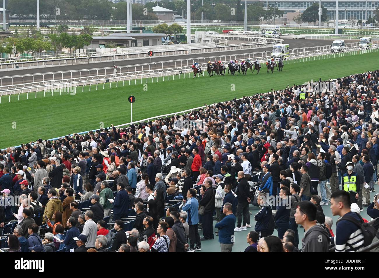 A general view showing the people watching horse racing at Sha Tin ...