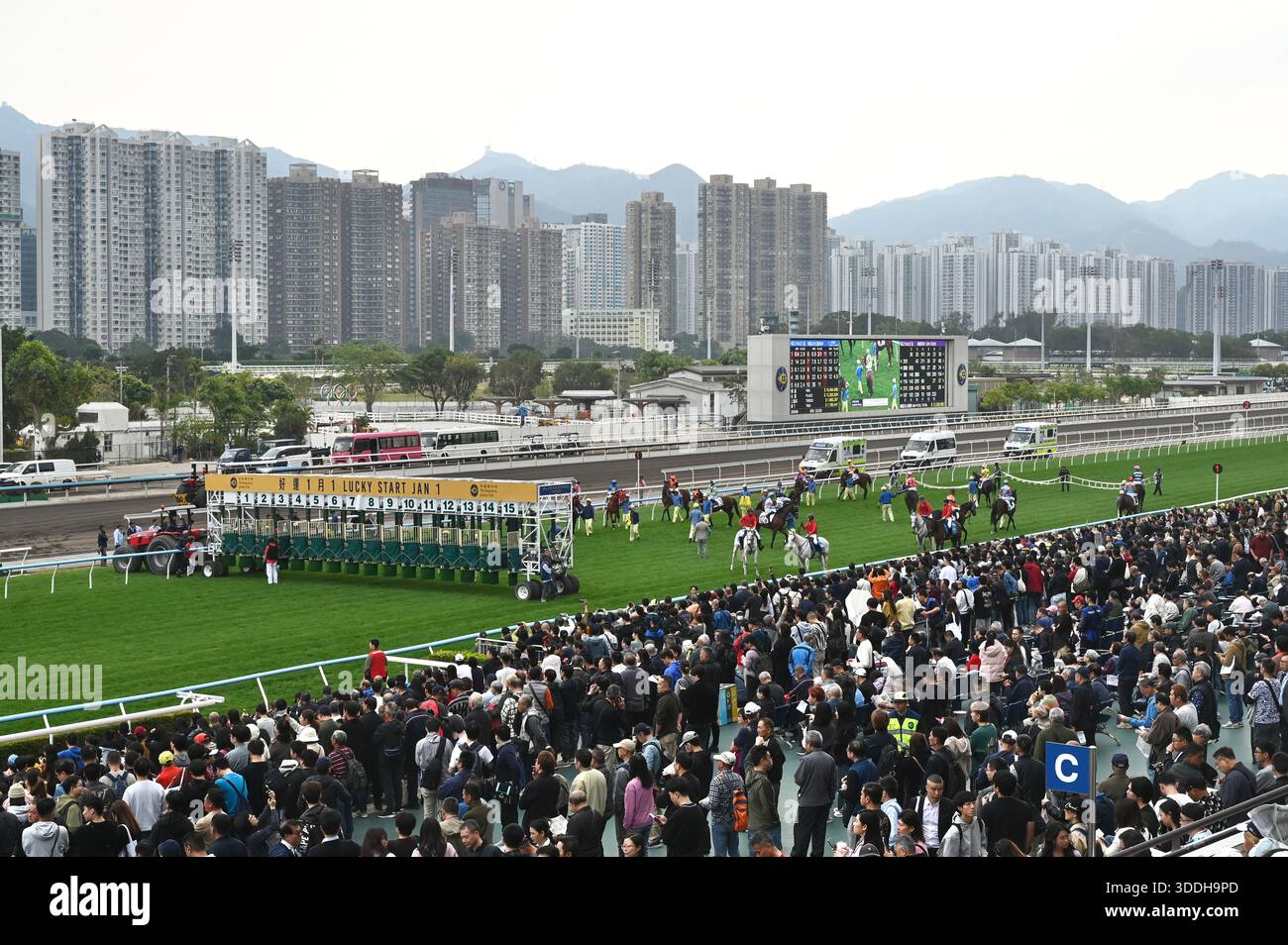 A general view showing the people watching horse racing at Sha Tin ...