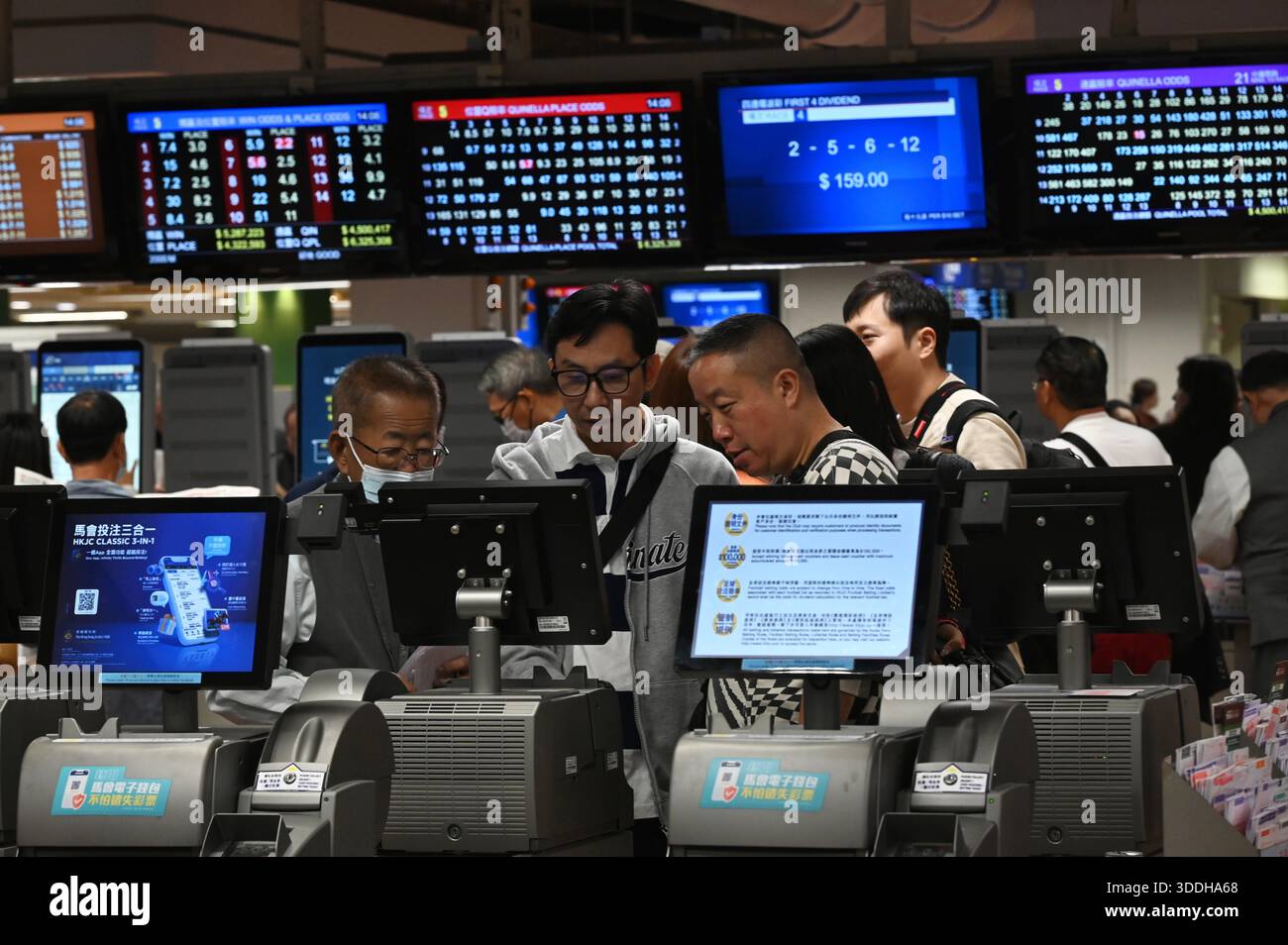 A general view showing the people buying lottery tickets at Sha Tin ...