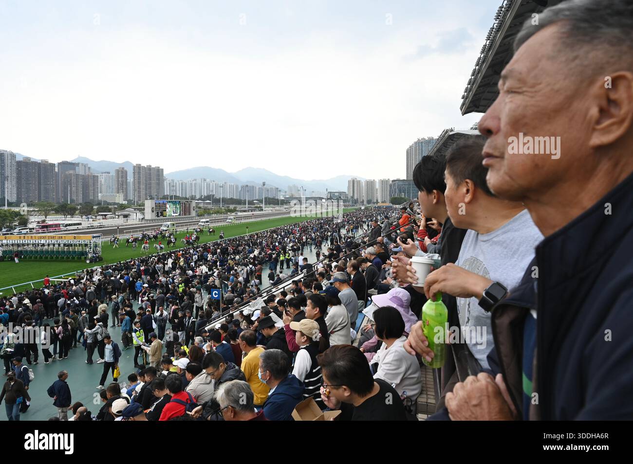 A general view showing the people watching horse racing at Sha Tin ...