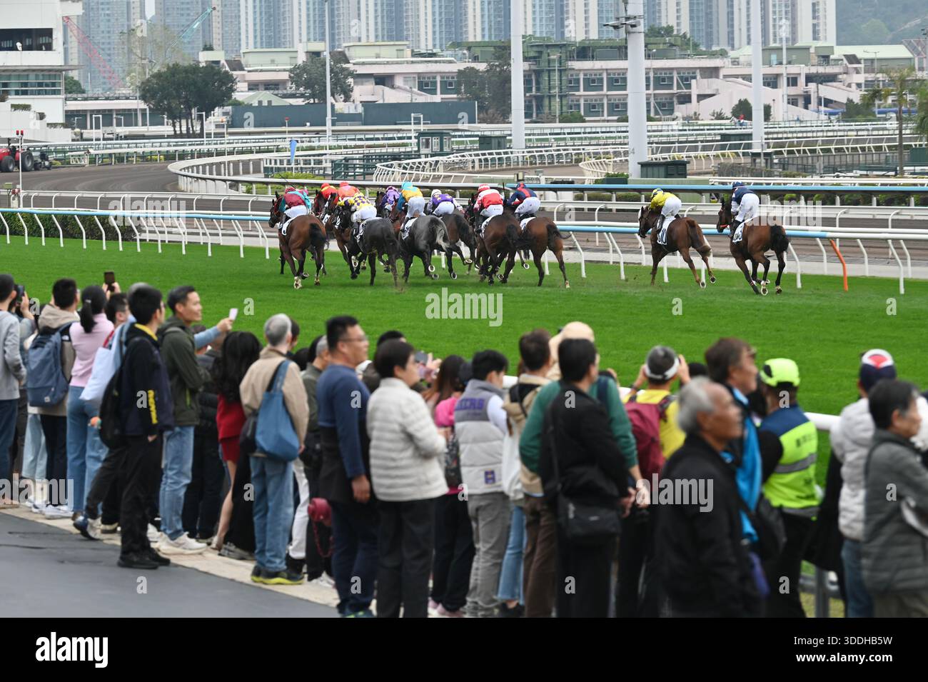 A general view showing the people watching horse racing at Sha Tin ...