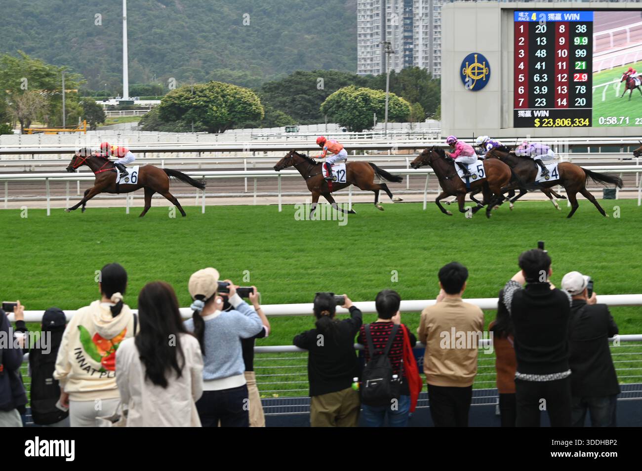 A general view showing the people watching horse racing at Sha Tin ...