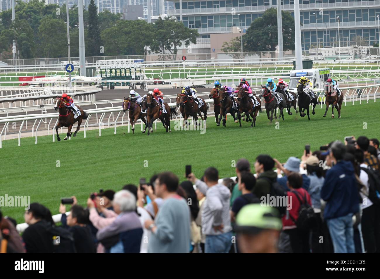 A general view showing the people watching horse racing at Sha Tin ...