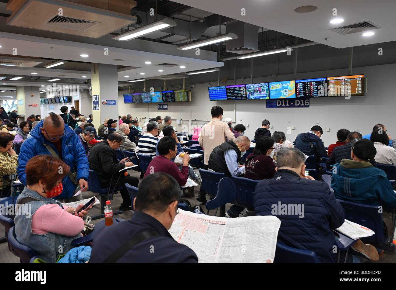 A general view showing the people watching the race information at Sha ...