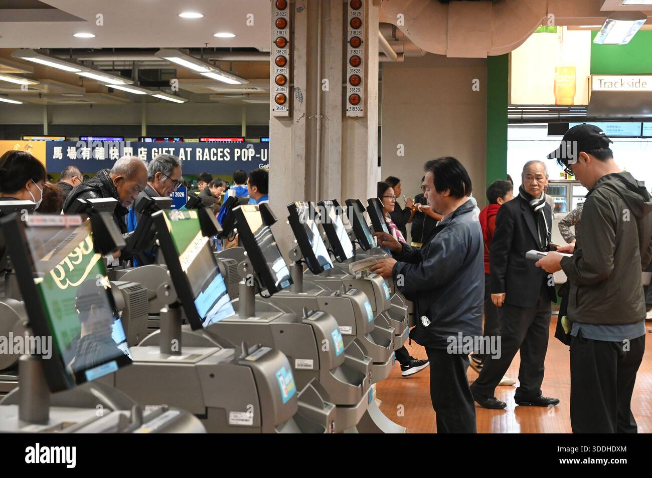 A general view showing the people buying lottery tickets at Sha Tin ...