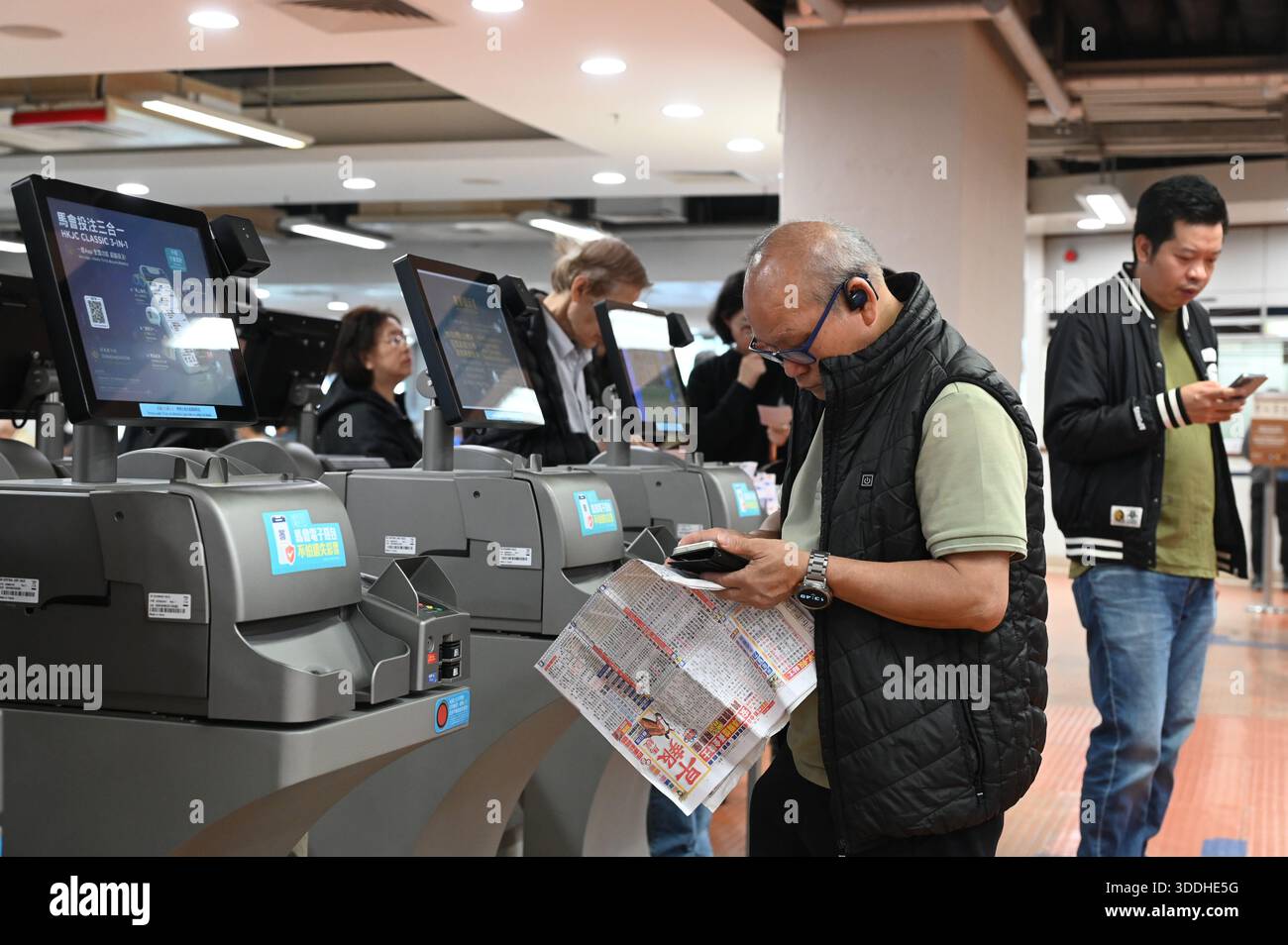 A general view showing the people buying lottery tickets at Sha Tin ...