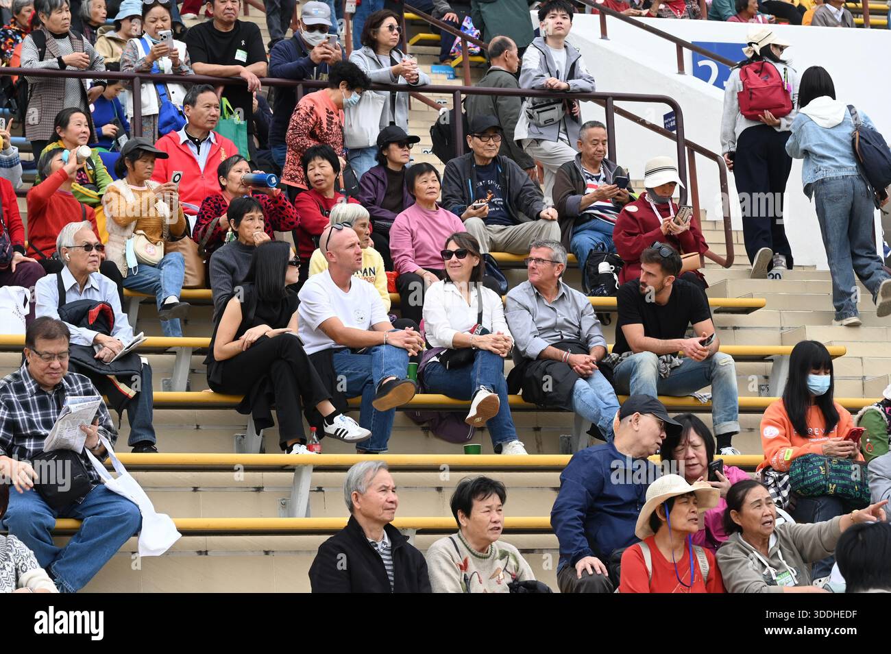 A general view showing the people watching horse racing at Sha Tin ...