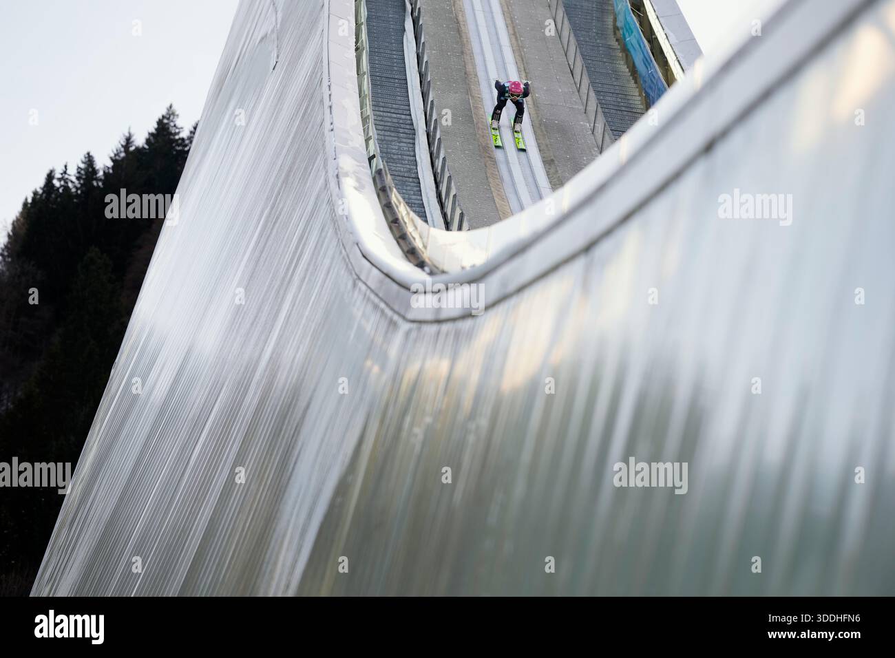 Felix Hoffmann, of Germany, goes down the ramp during his trial jump at ...