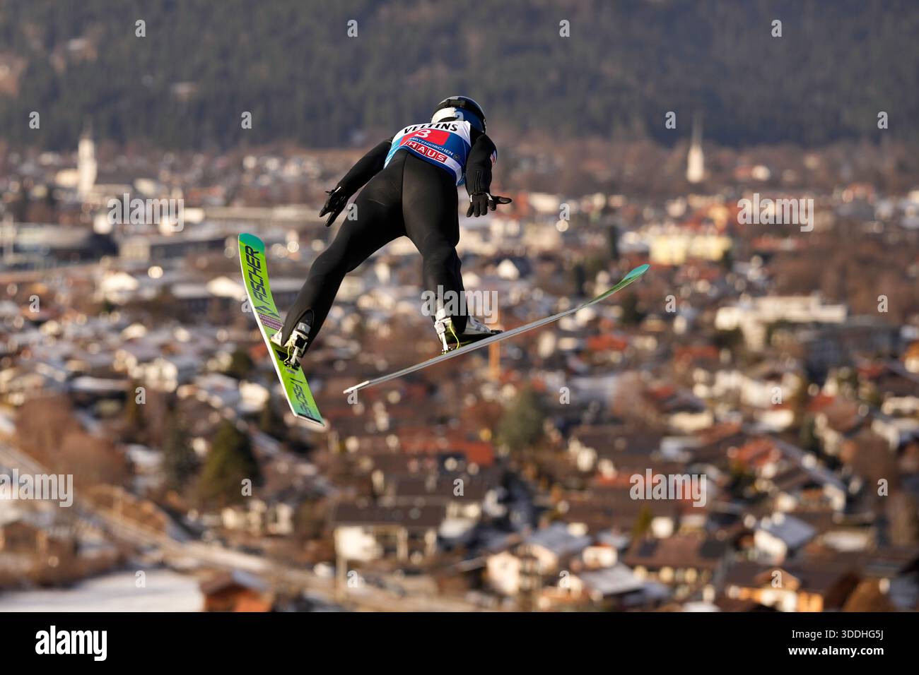 Stephan Embacher, of Austria, soars through the air during his trial ...