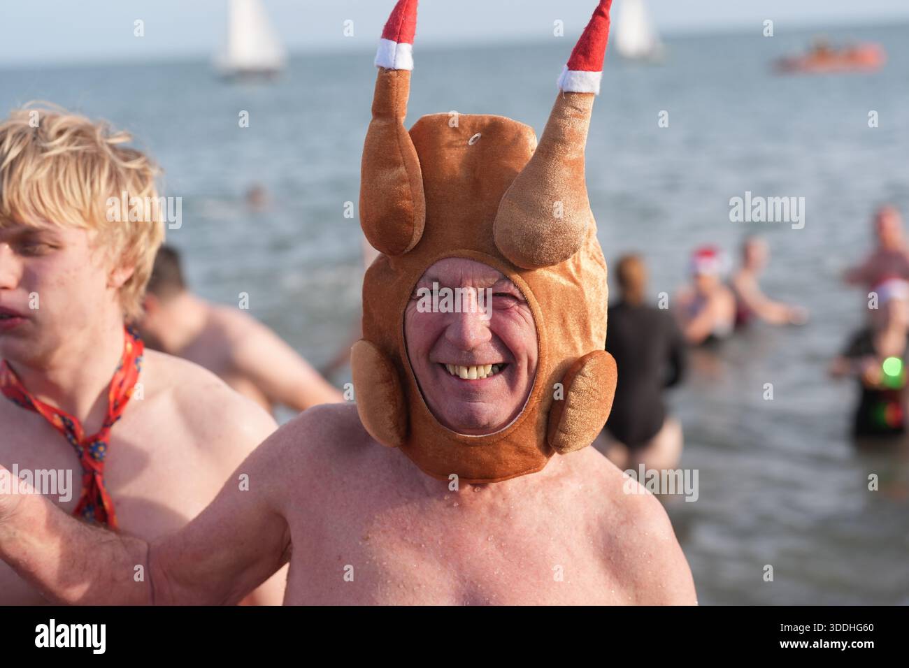 Swimmers take part in the annual New Year’s Day charity swim on Bray ...