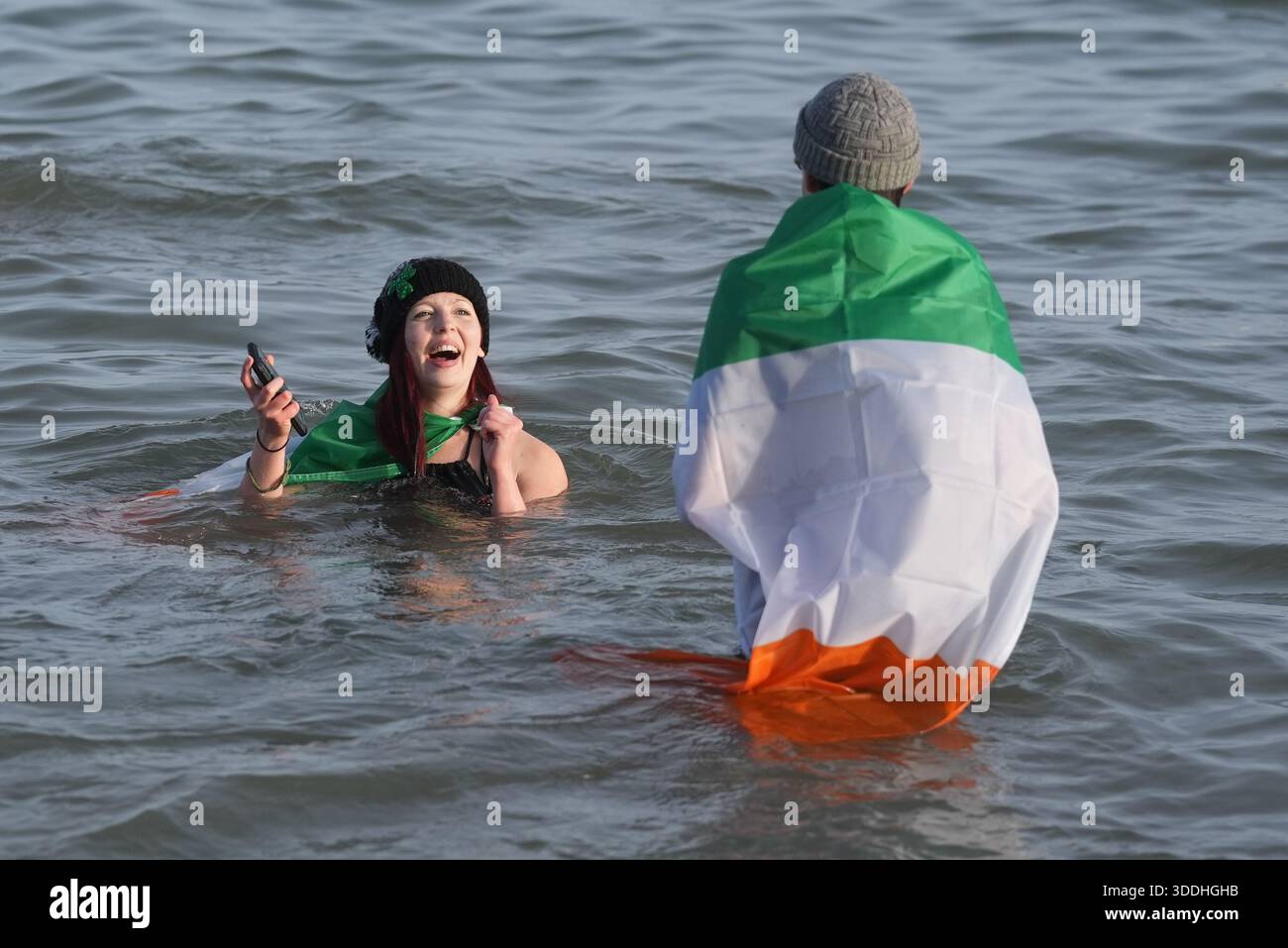 Swimmers take part in the annual New Year’s Day charity swim on Bray ...