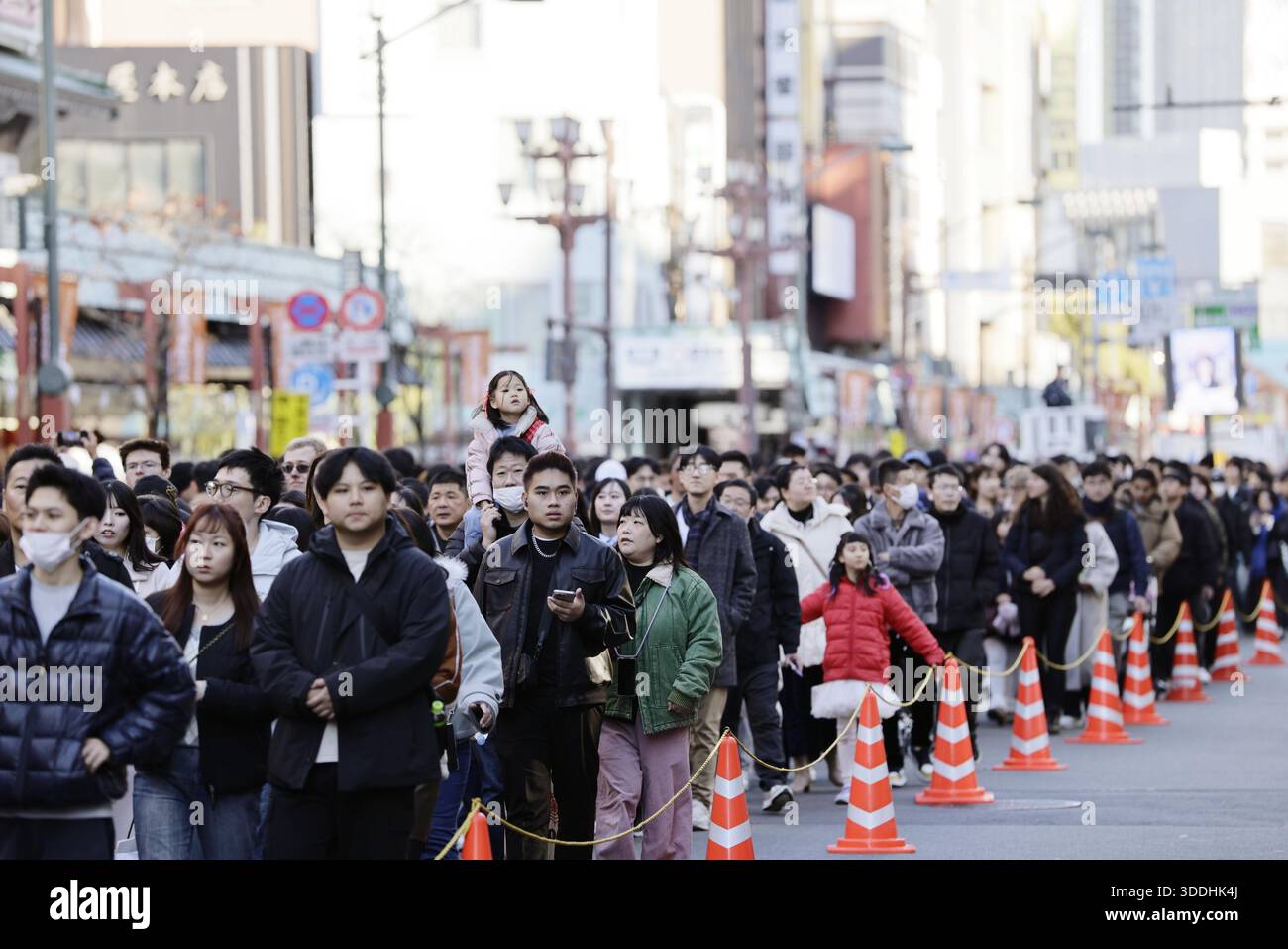 A street leading to Senso-ji temple in Tokyo's Asakusa area is crowded ...