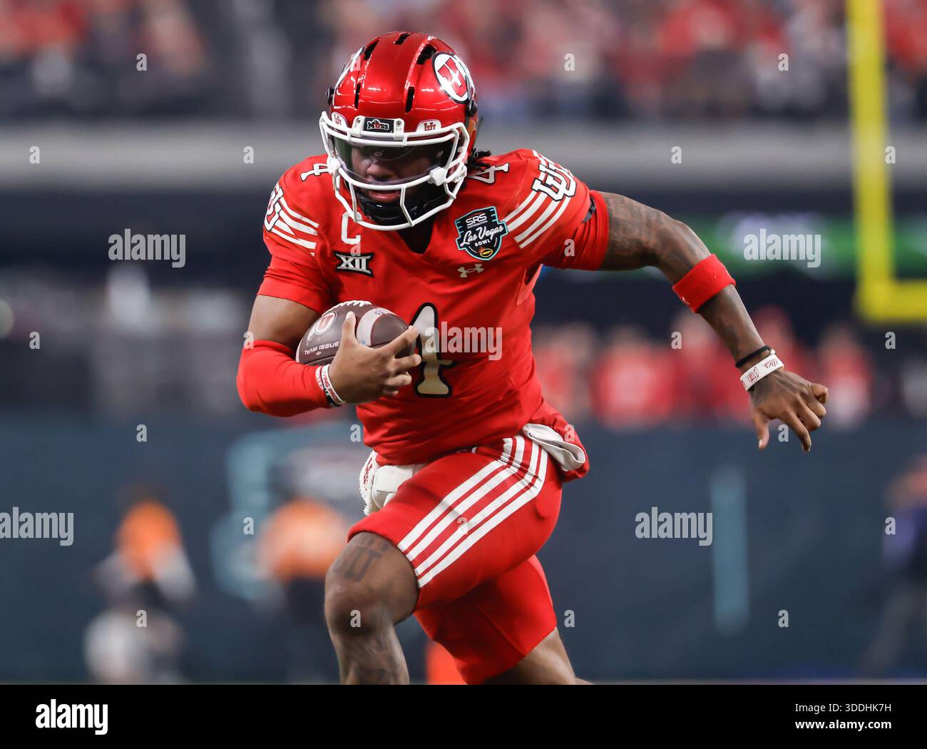 LAS VEGAS, NEVADA: Utah Utes quarterback Devon Dampier (4) scrambles ...