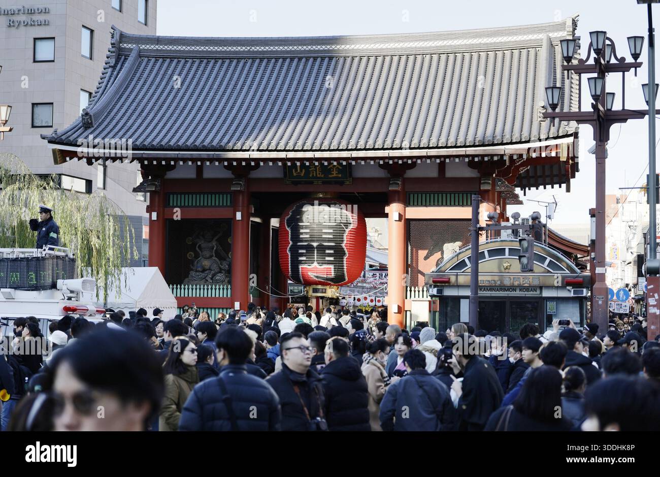 A street leading to Senso-ji temple in Tokyo's Asakusa area is crowded ...