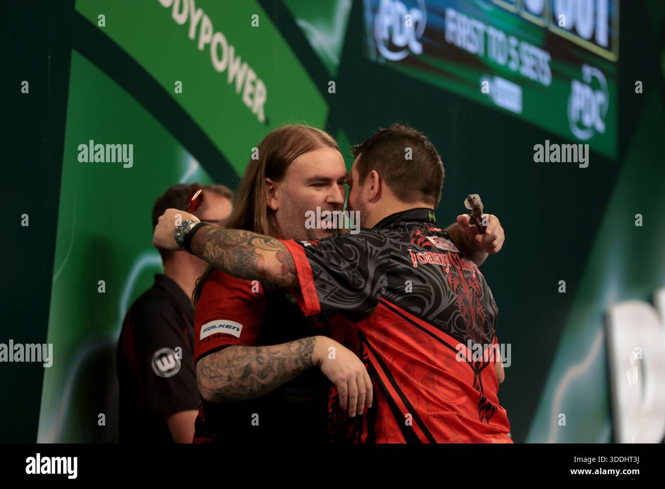 Ryan Seale and Jonny Clayton embrace after their match on day eighteen ...