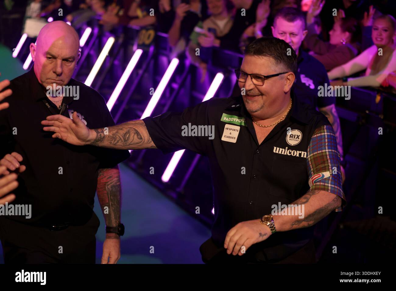 Gary Anderson makes his way to the stage before his match against ...