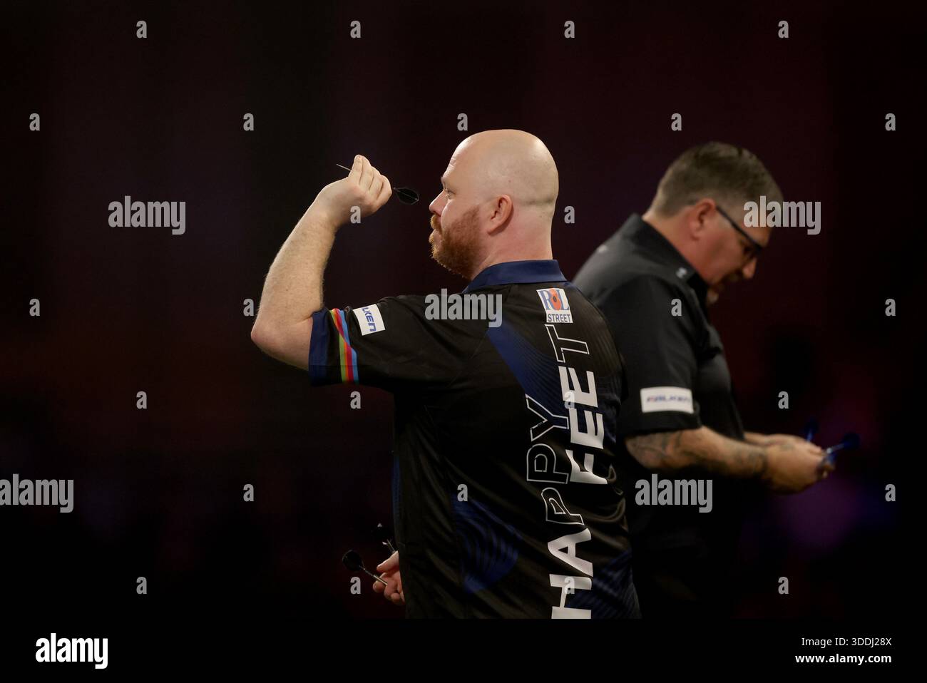 Justin Hood in action against Gary Anderson on day eighteen of the ...