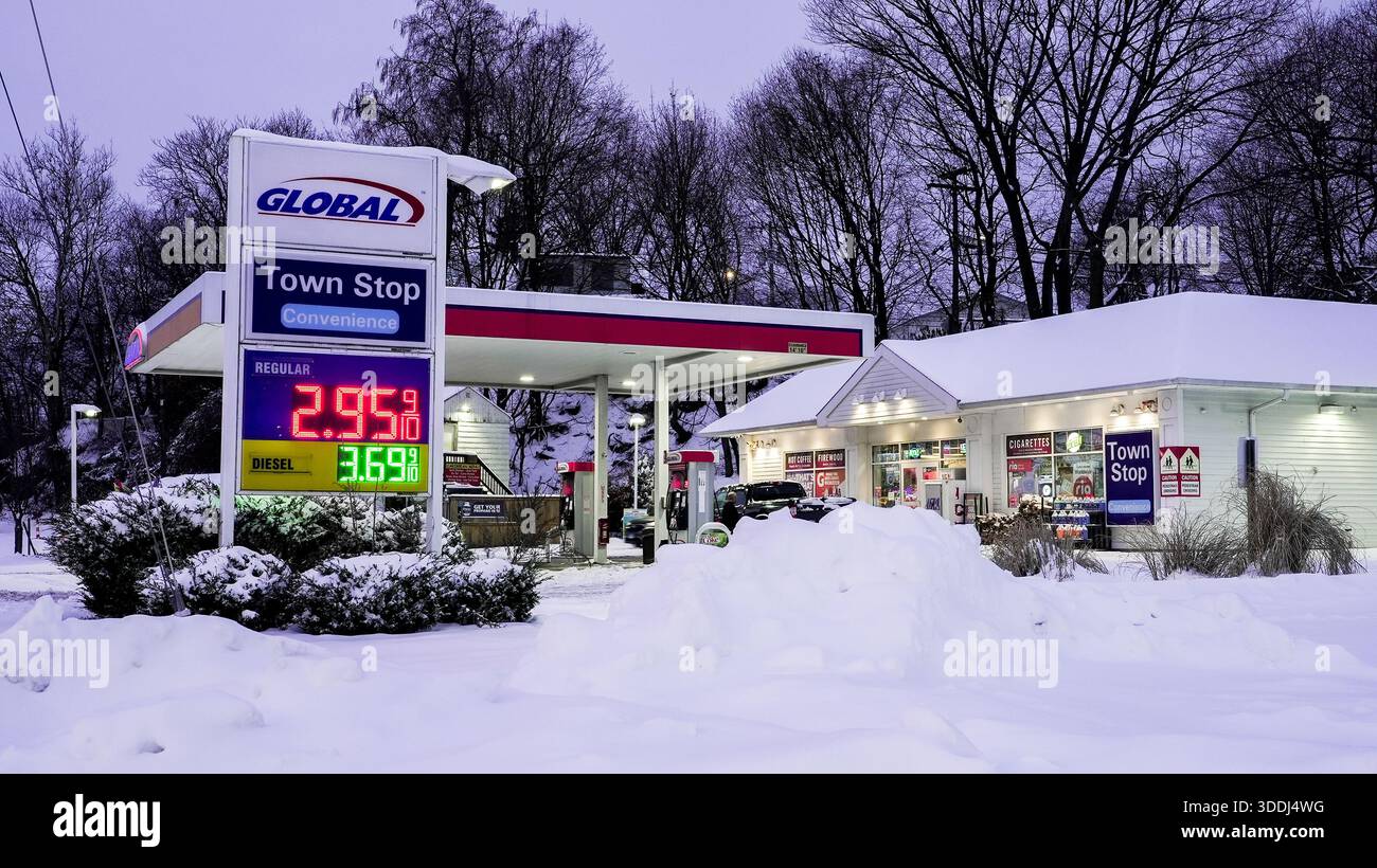 NORWALK, CT, USA - DECEMBER 27, 2025: Snow falls covering Global gas ...