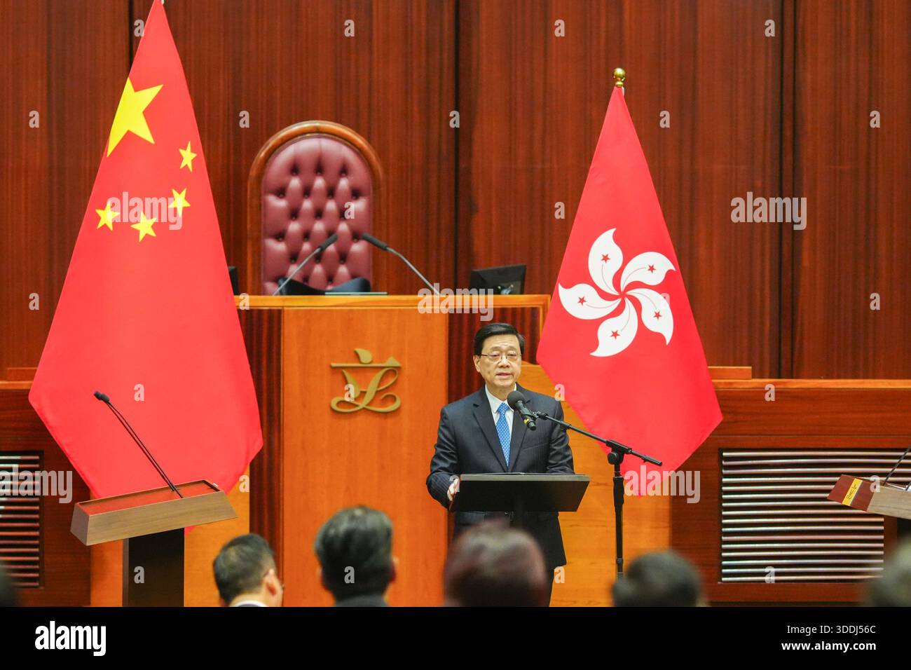 John Lee Ka-chiu (rear), Chief Executive of Hong Kong, delivering ...