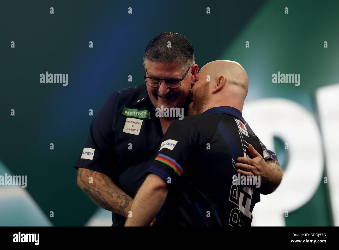 Gary Anderson and Justin Hood embrace each other after their match on ...
