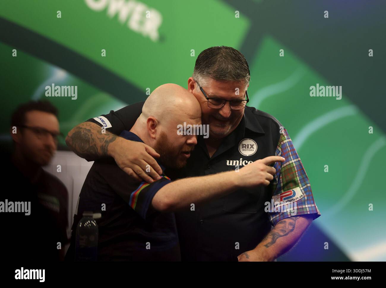 Gary Anderson and Justin Hood embrace each other after their match on ...