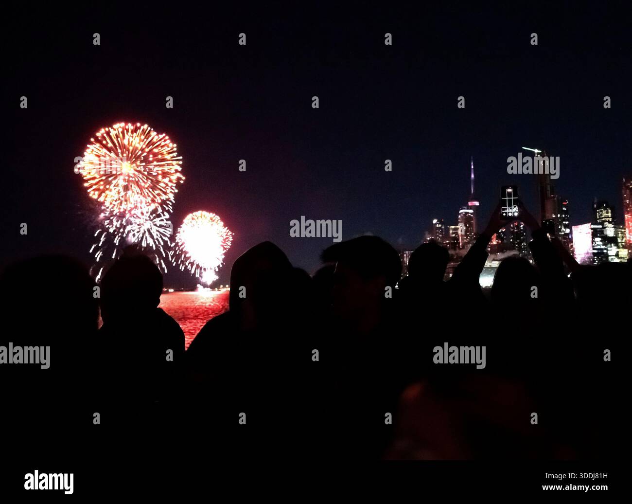 Revellers watch as fireworks light up Toronto's inner harbour to ring ...