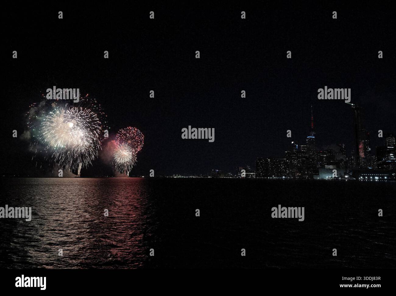 Revellers watch as fireworks light up Toronto's inner harbour to ring ...
