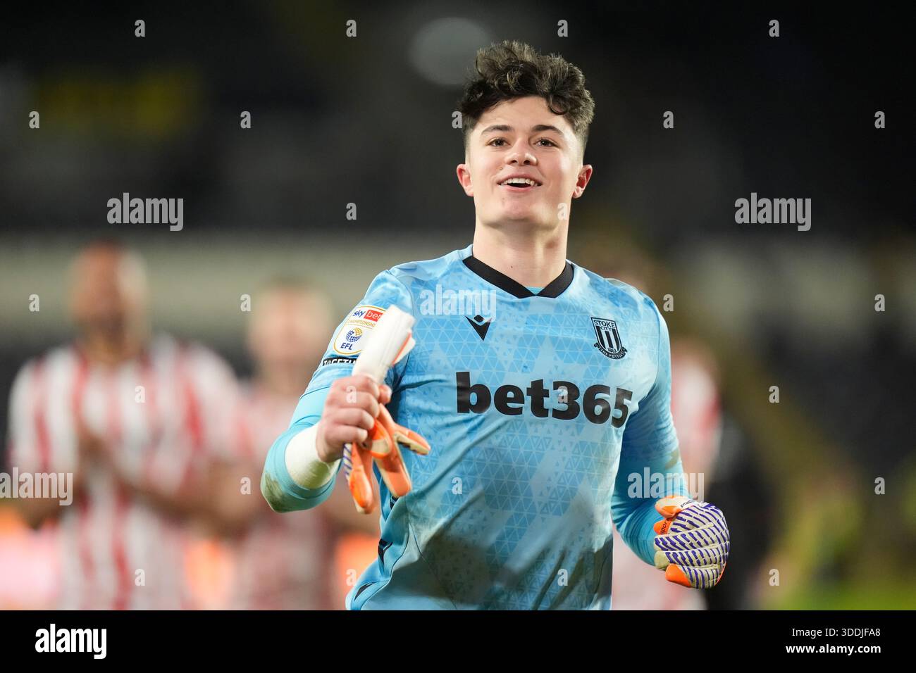 Stoke City's goalkeeper Tommy Simkin celebrates at full time following ...