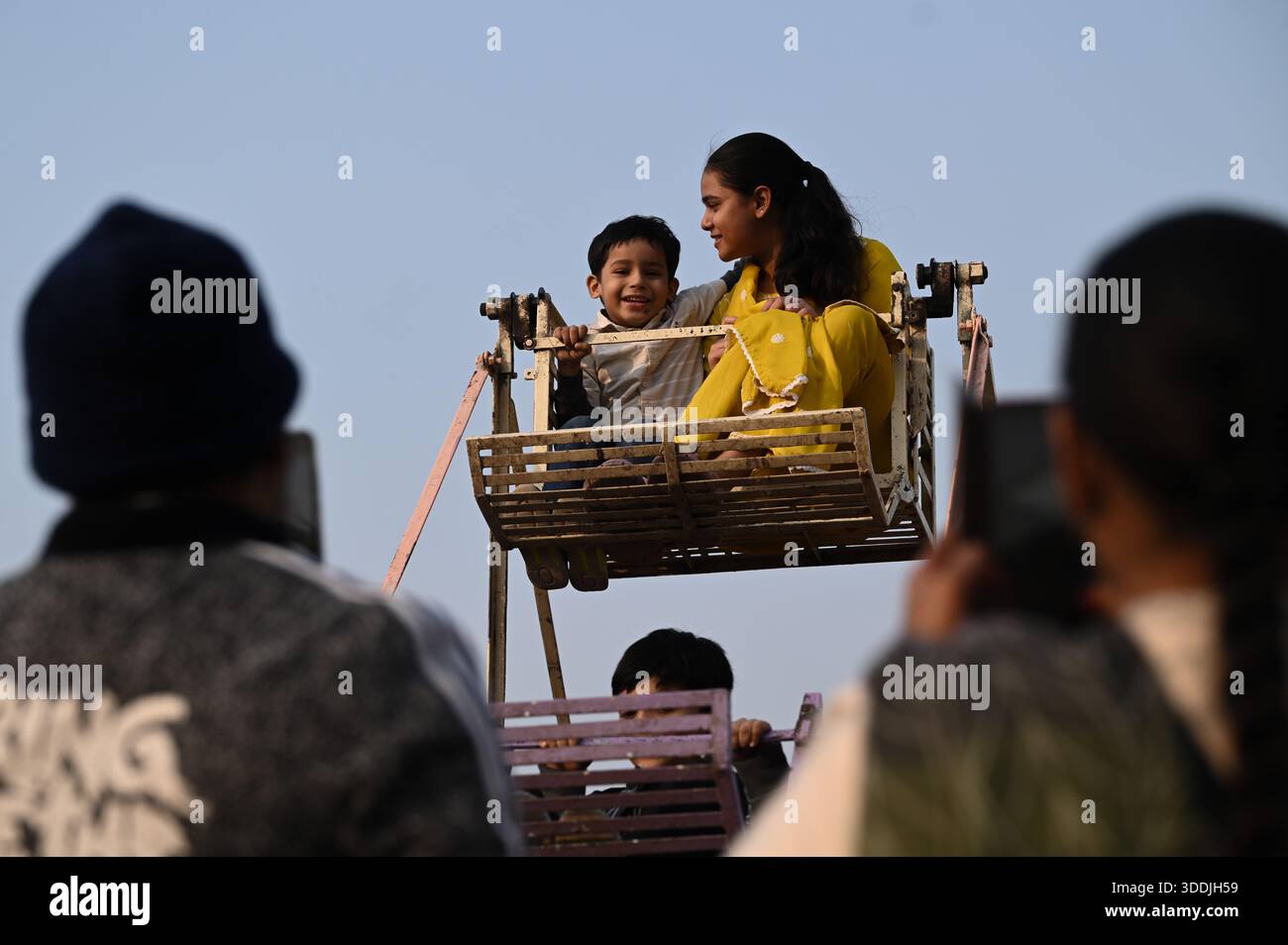 KOLKATA, INDIA - JANUARY 1: Kids enjoy merry-go-round on New Year's Day ...