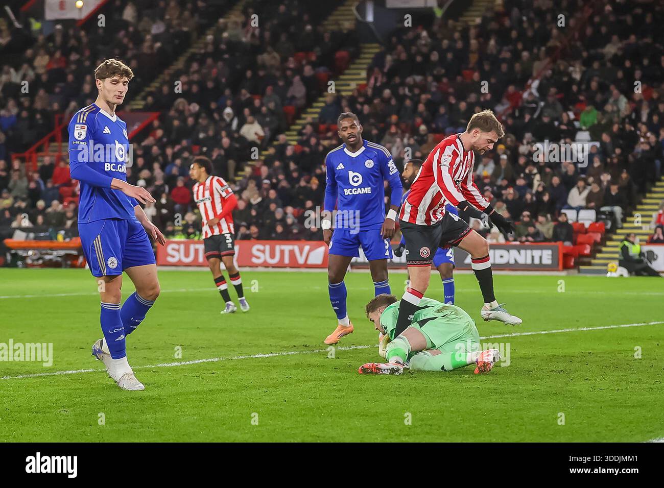 Leicester keeper Jakub Stolarczyk saves at the feet of Patrick Bamford ...