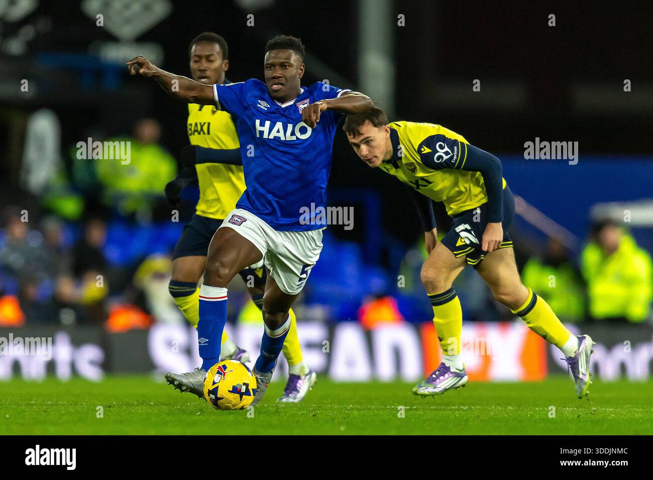 Azor Matusiwa of Ipswich Town and Luke Harris of Oxford United battle ...