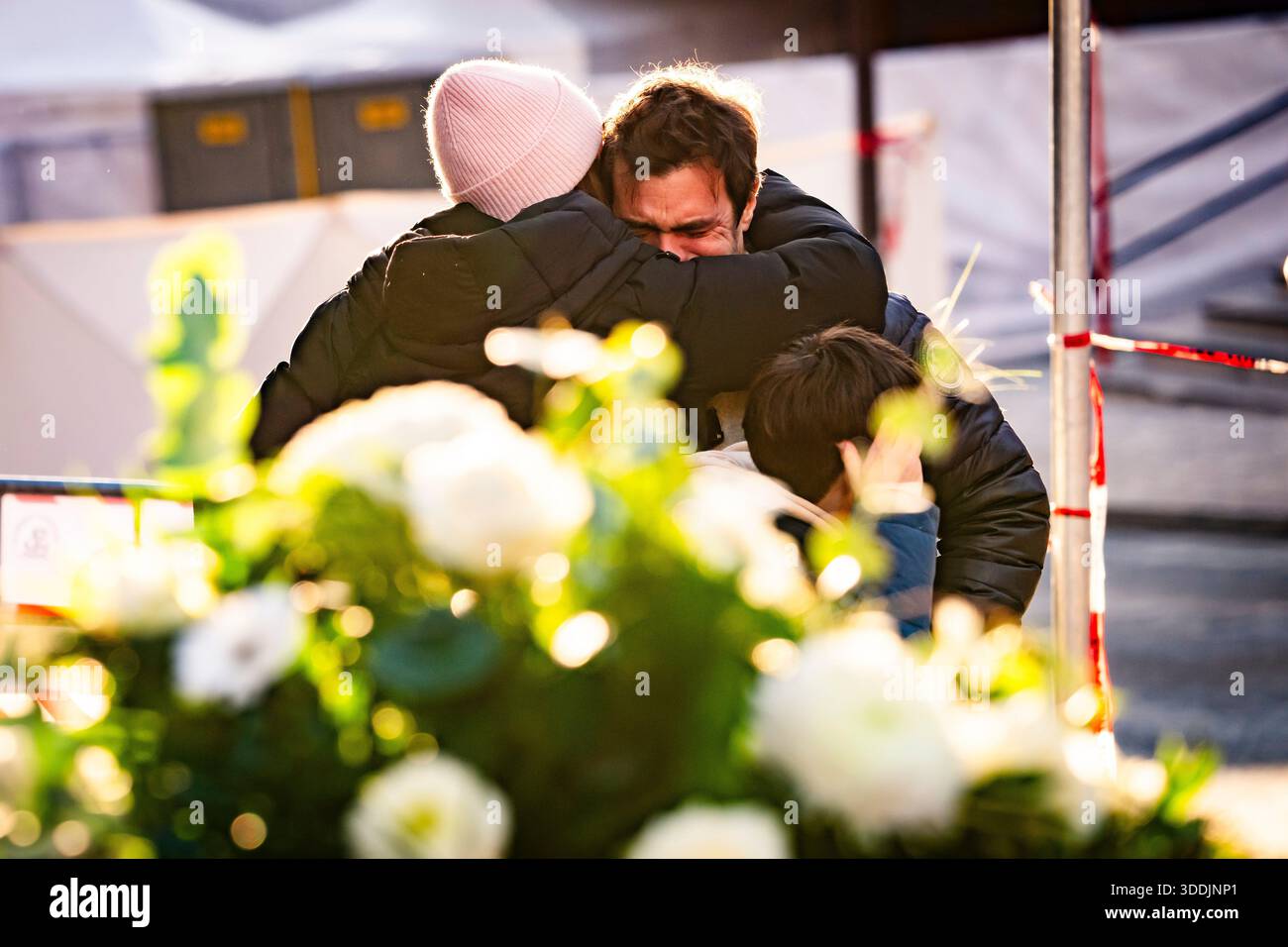 People cry at the scene after a fire broke out at the "Le Constellation ...