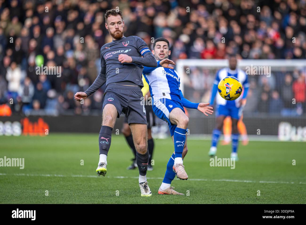 Tom Naylor of Chesterfield and Tom Pett of Oldham Athletic battles for ...