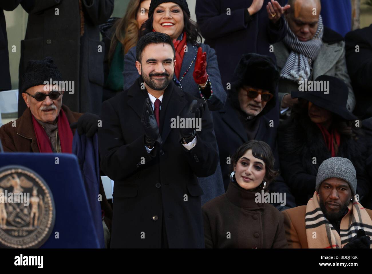 Mayor Zohran Mamdani reacts after arriving for his swearing-in ceremony ...