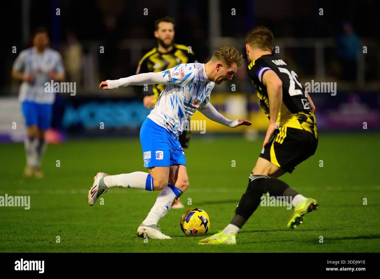 Barrow's Ben Whitfield in action with Salford's Jorge Grant during the ...
