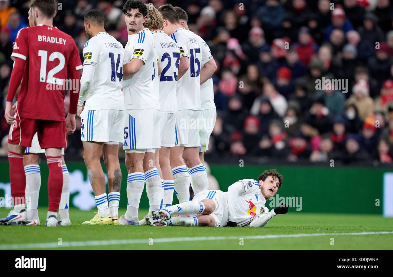 Leeds United's Brenden Aaronson lies down behind the wall during the ...