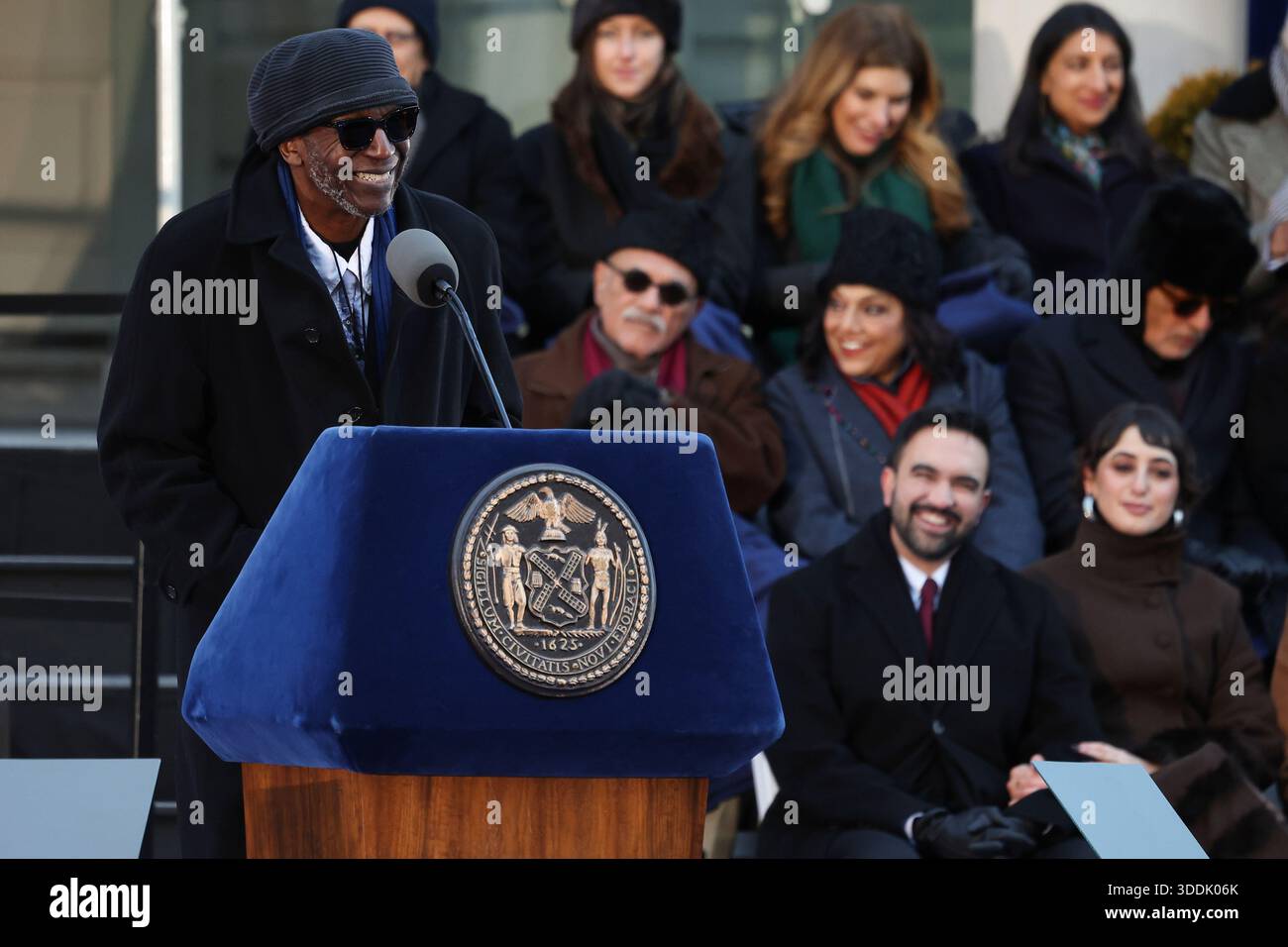 Cornelius Eady, left, recites a poem during a public swearing-in ...